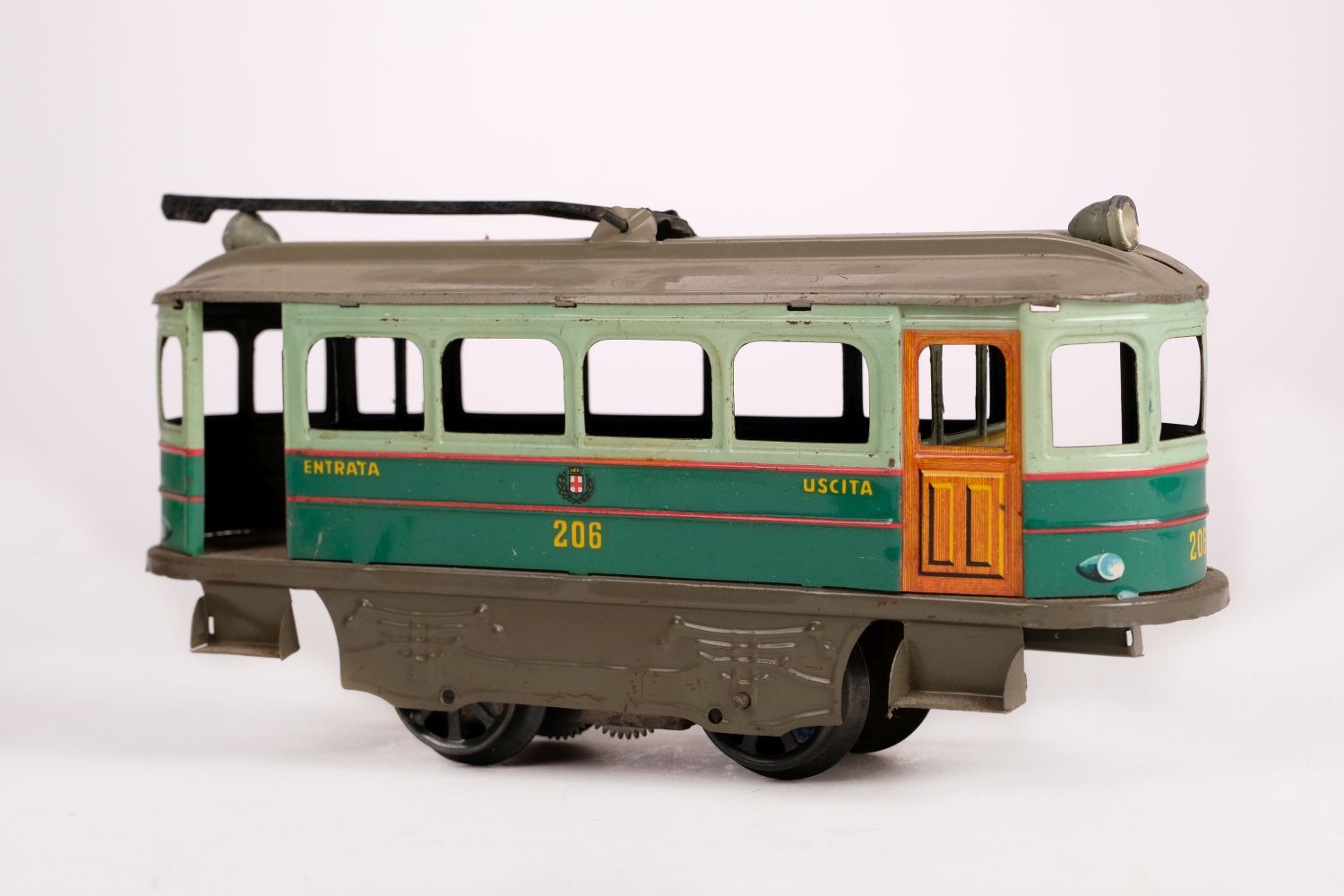 Lot 10 - Trams. A collection of toy trams and cars etc.