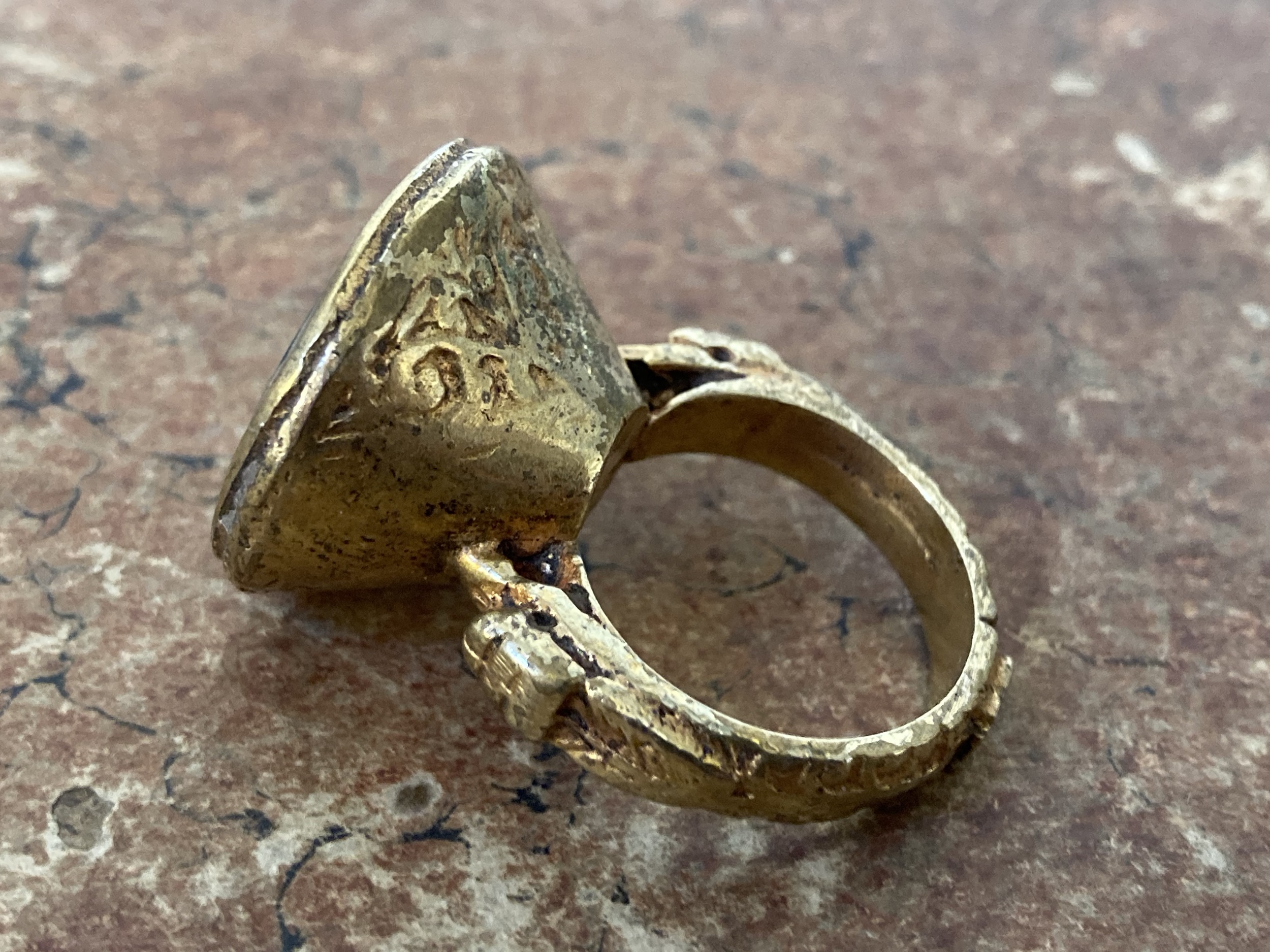 Lot 185 - Roman. A Roman gilt metal ring set with