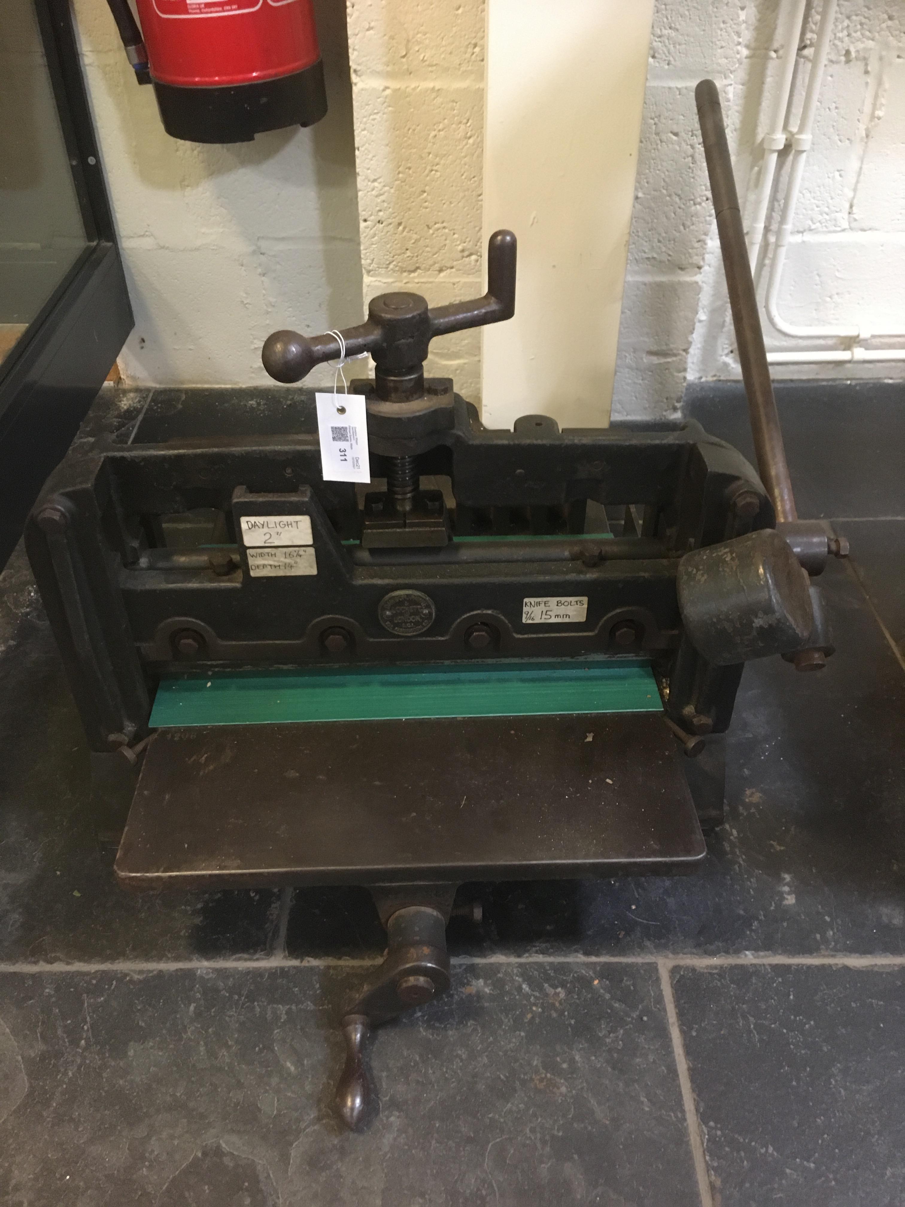 Lot 311 - Guillotine. A cast iron bench guillotine by