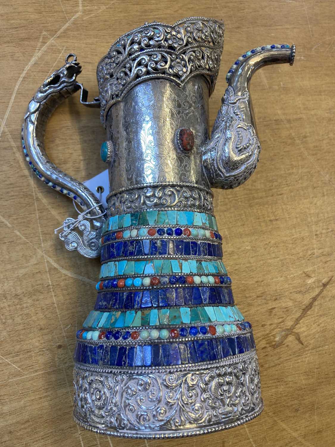 Lot 54 - Tibet. A Tibetan white metal ewer