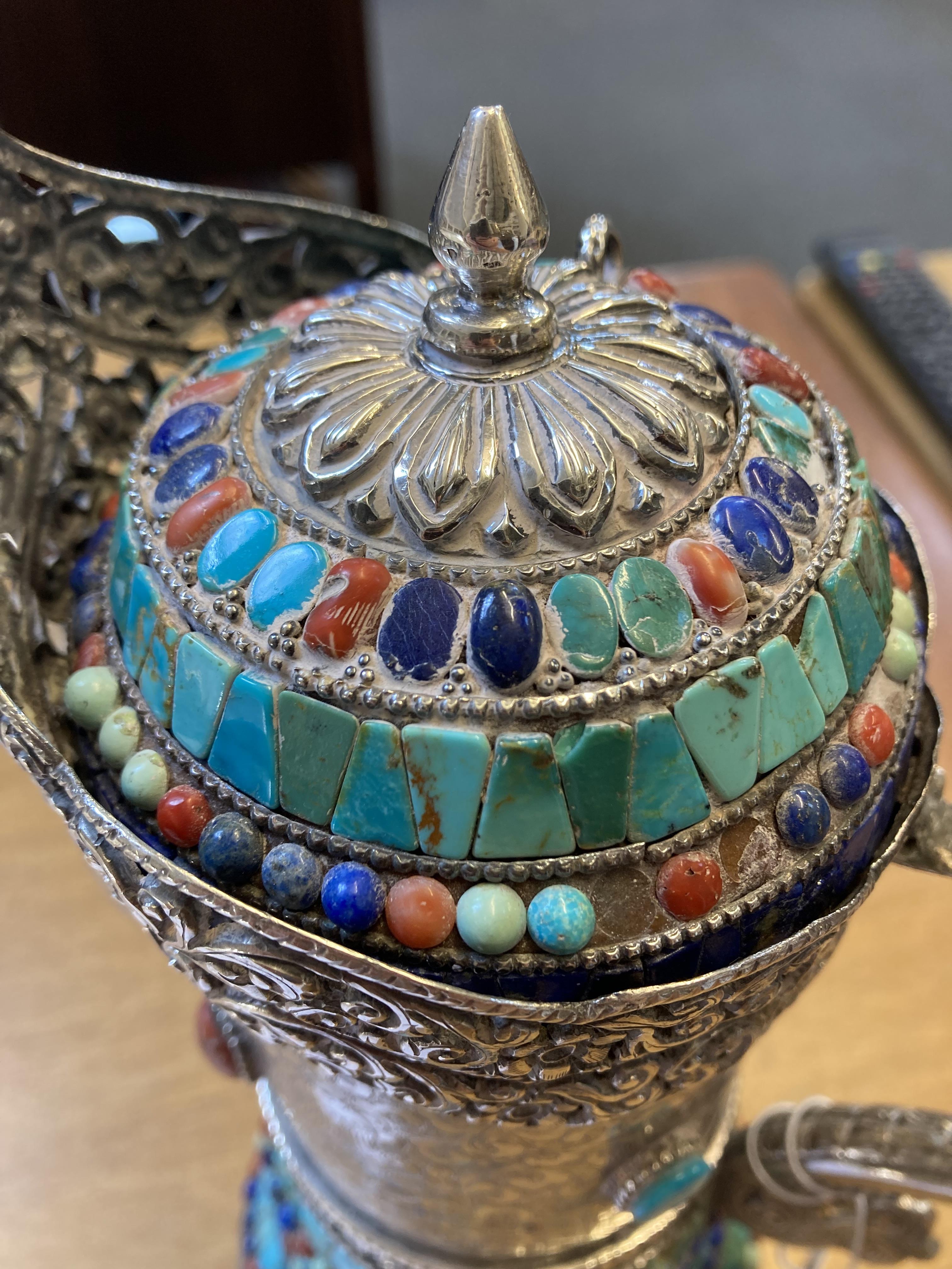 Lot 54 - Tibet. A Tibetan white metal ewer