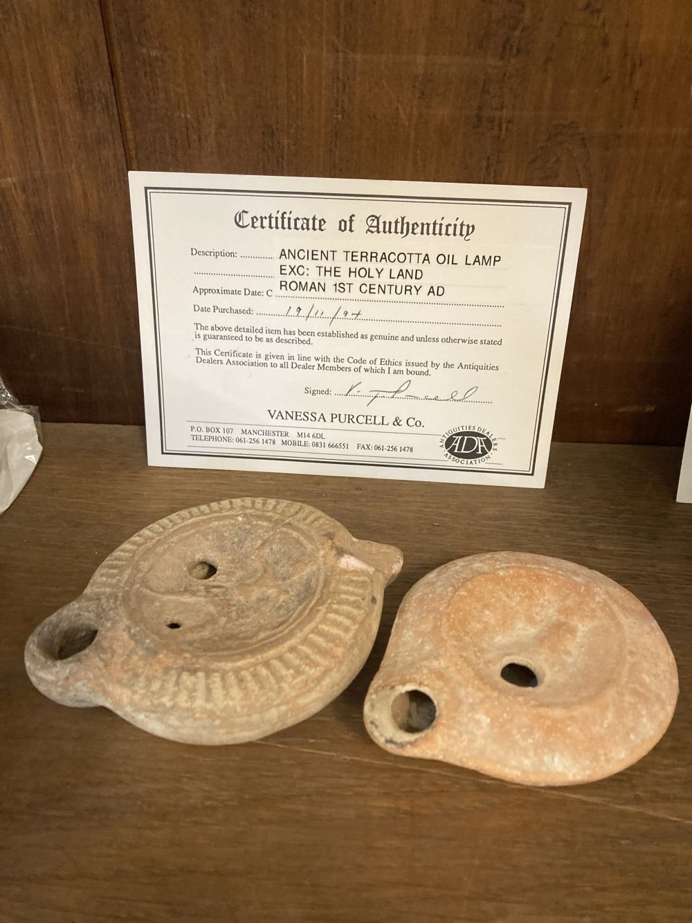 Lot 437 - Oil Lamp. A Roman terracotta oil lamp, circa