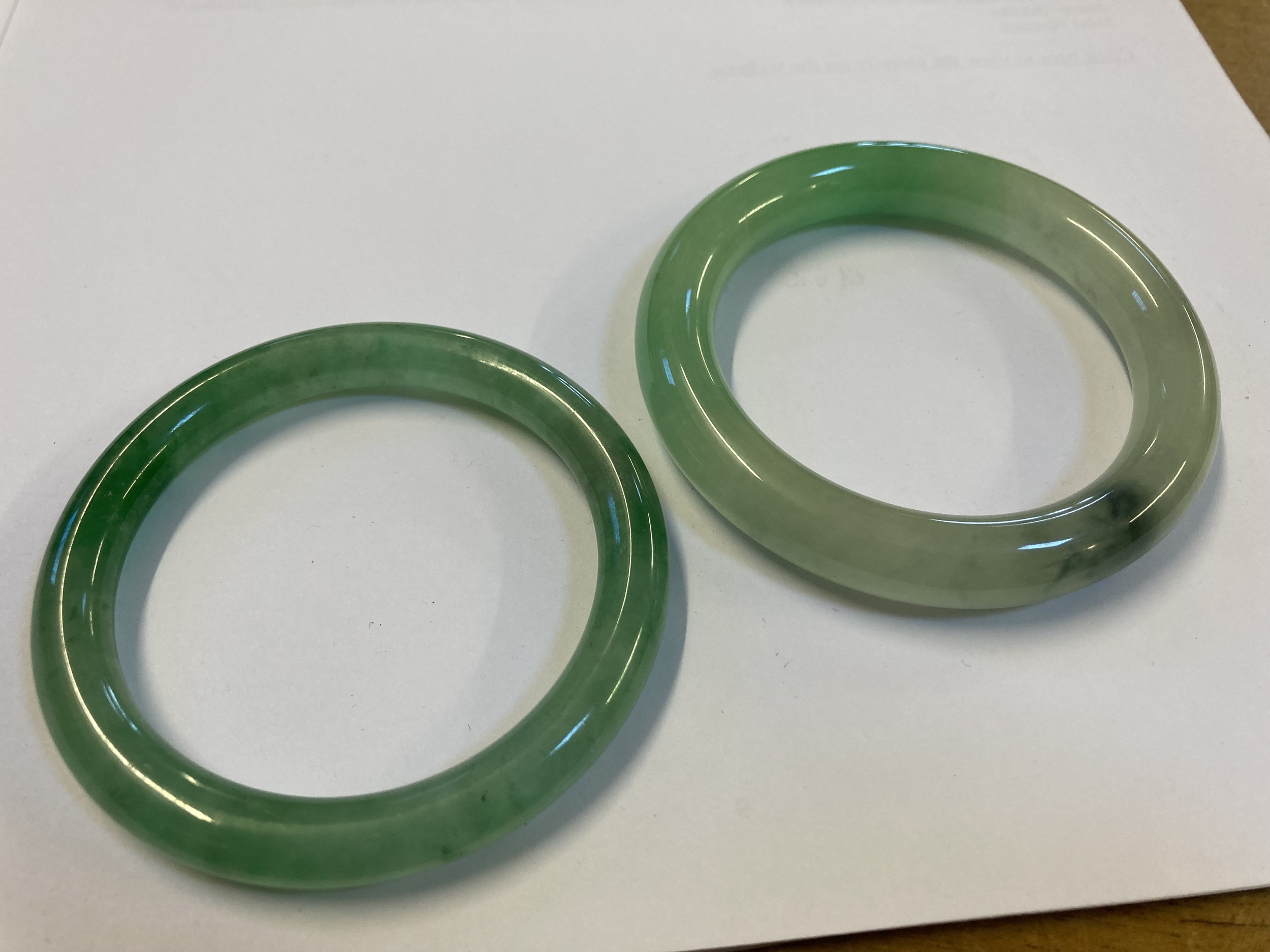 Lot 447 - Jade. Two Chinese jade bangles