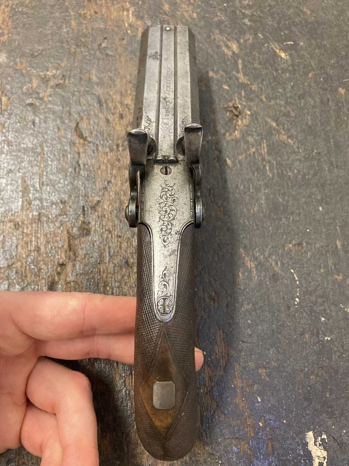 Lot 157 - Pistol. A Victorian double barrel pistol by