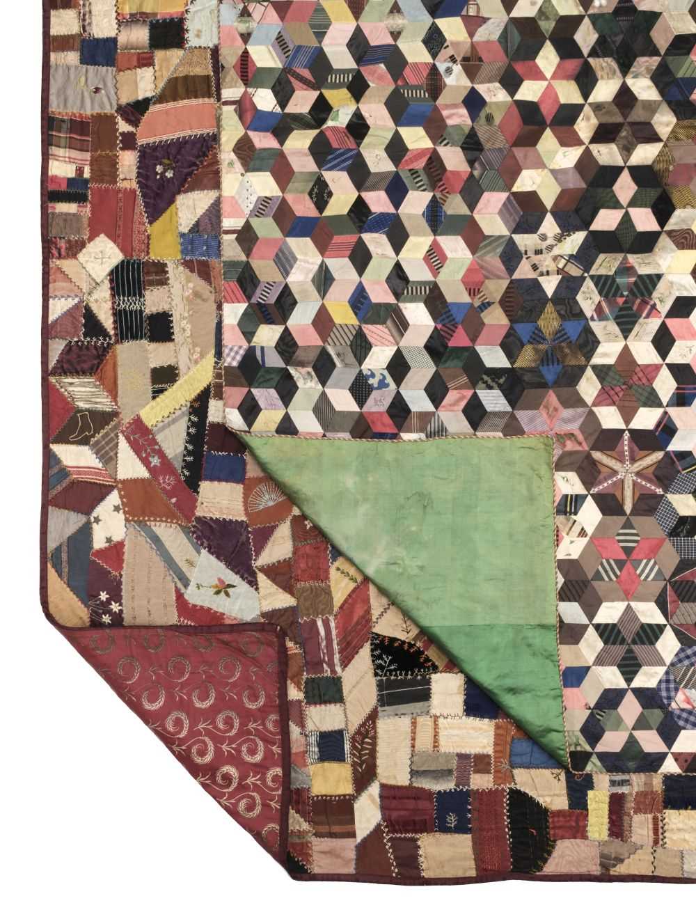 Lot 679 - Quilt. A silk patchwork quilt, mid 19th