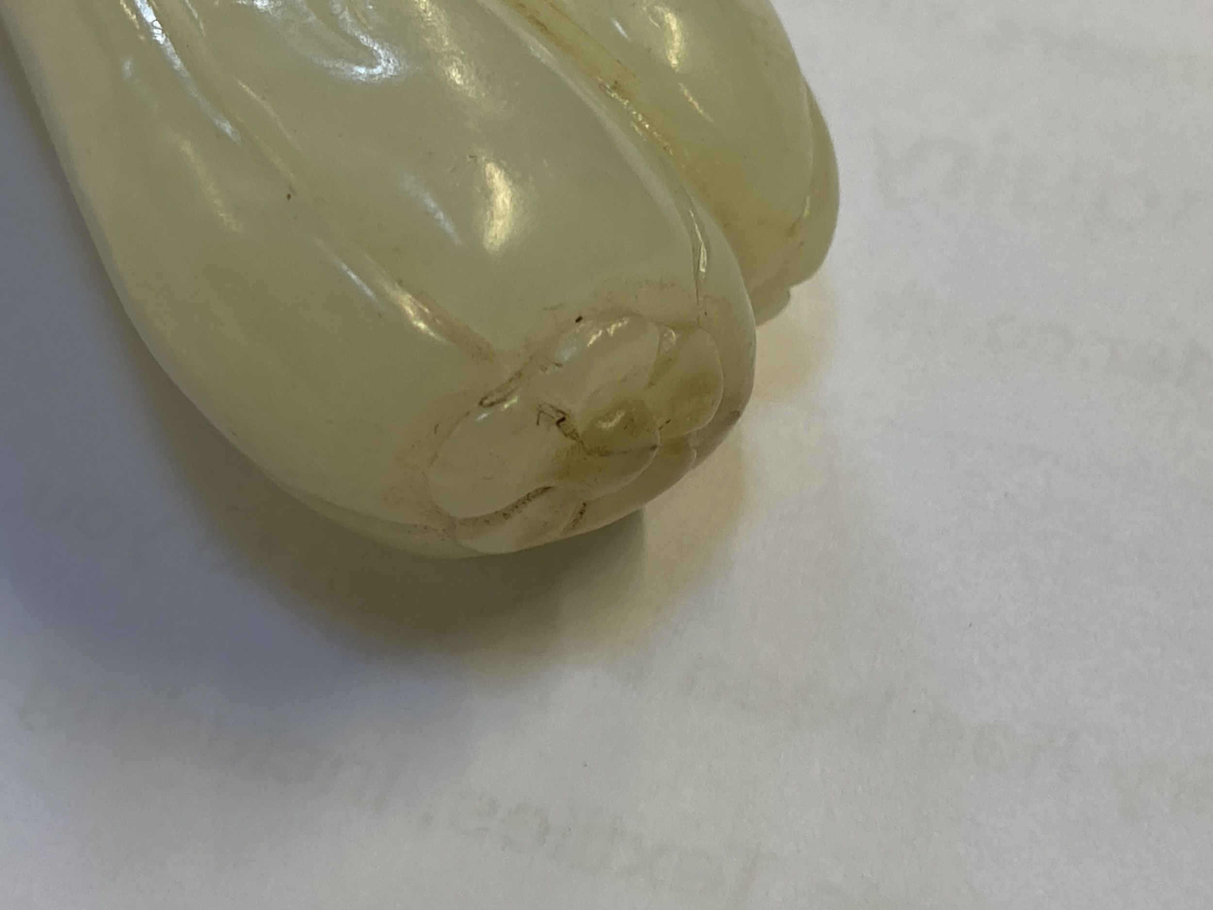 Lot 488 - Jade. A Chinese white jade fruit carving