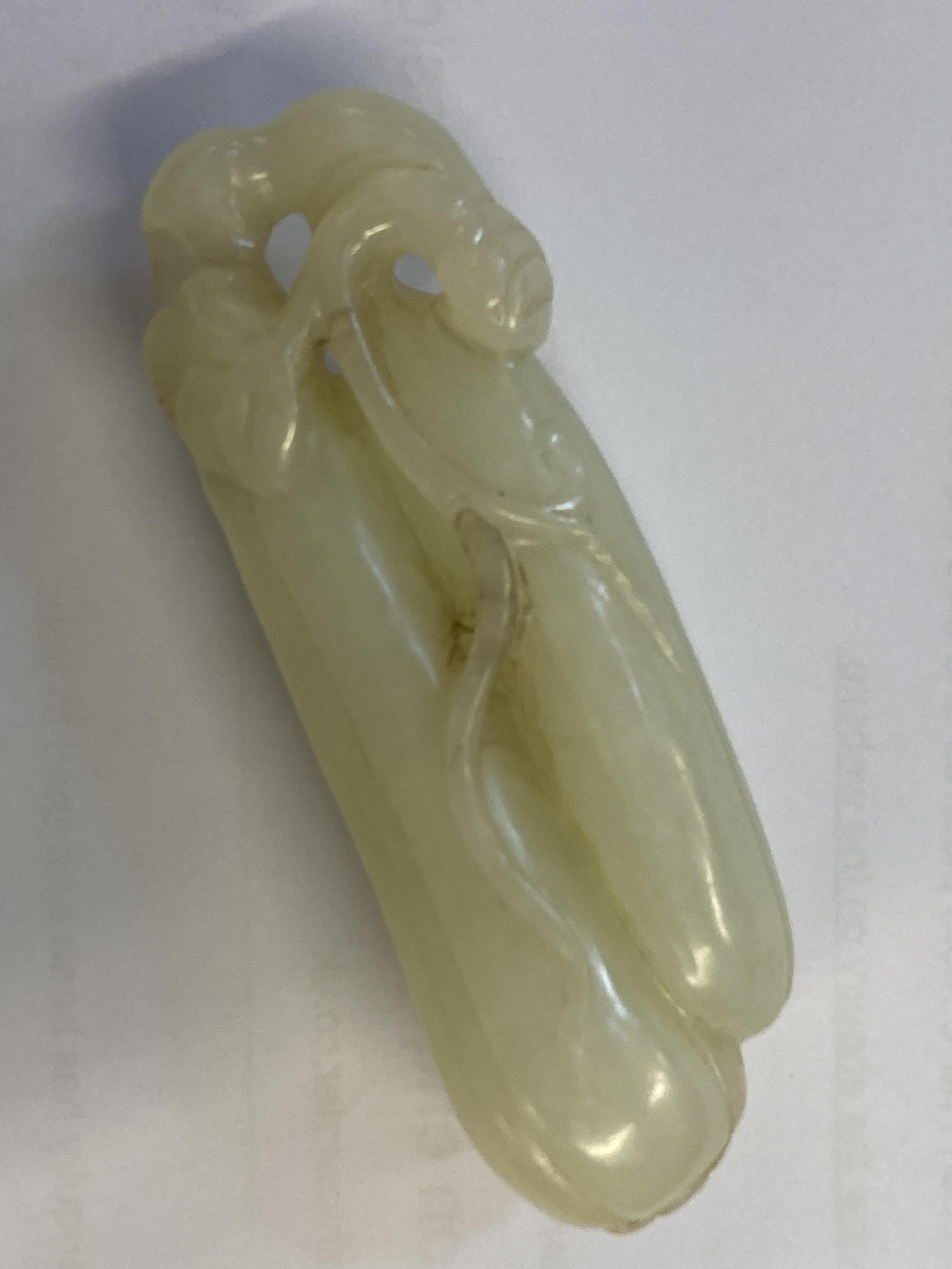 Lot 488 - Jade. A Chinese white jade fruit carving