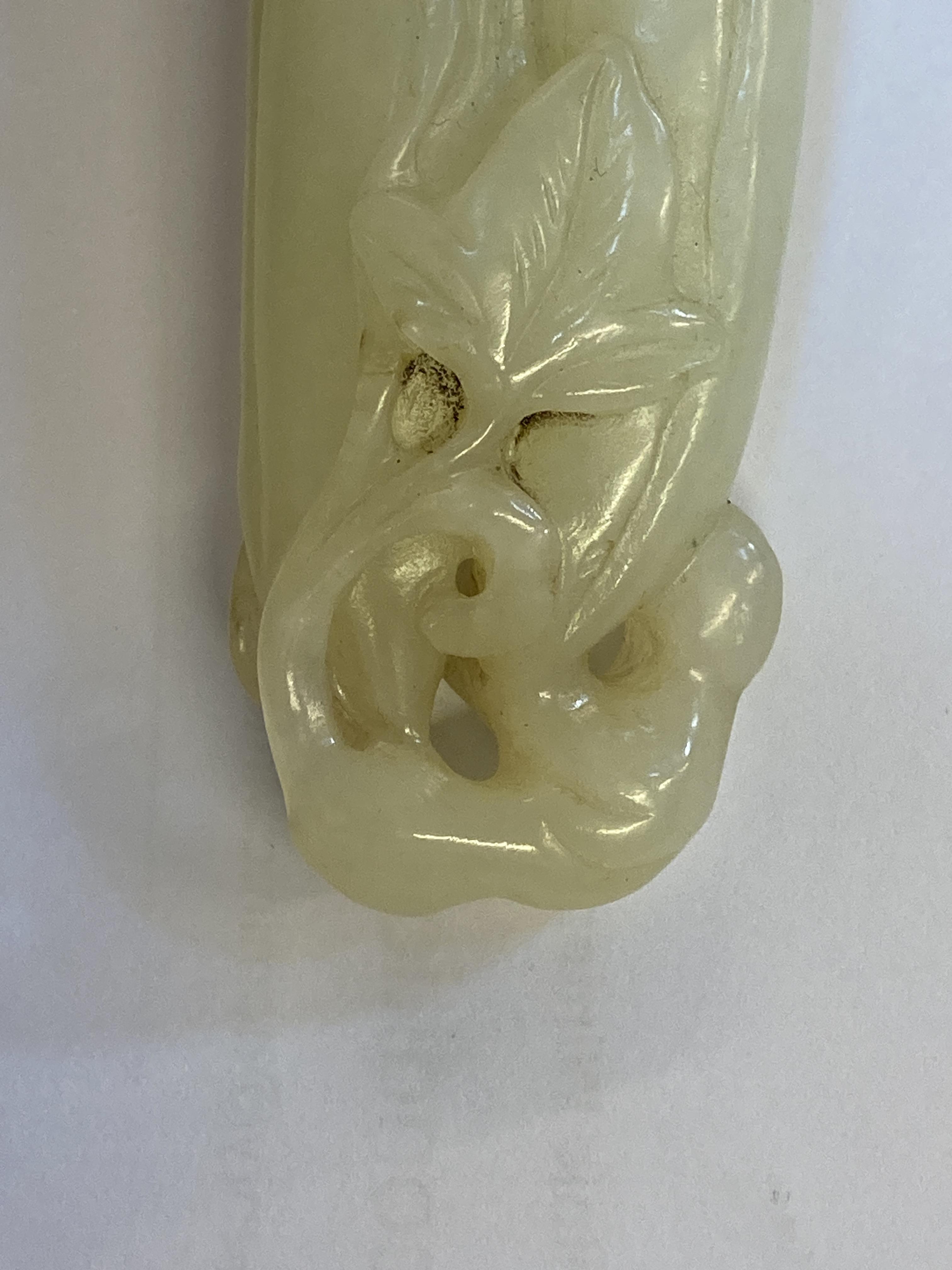 Lot 488 - Jade. A Chinese white jade fruit carving