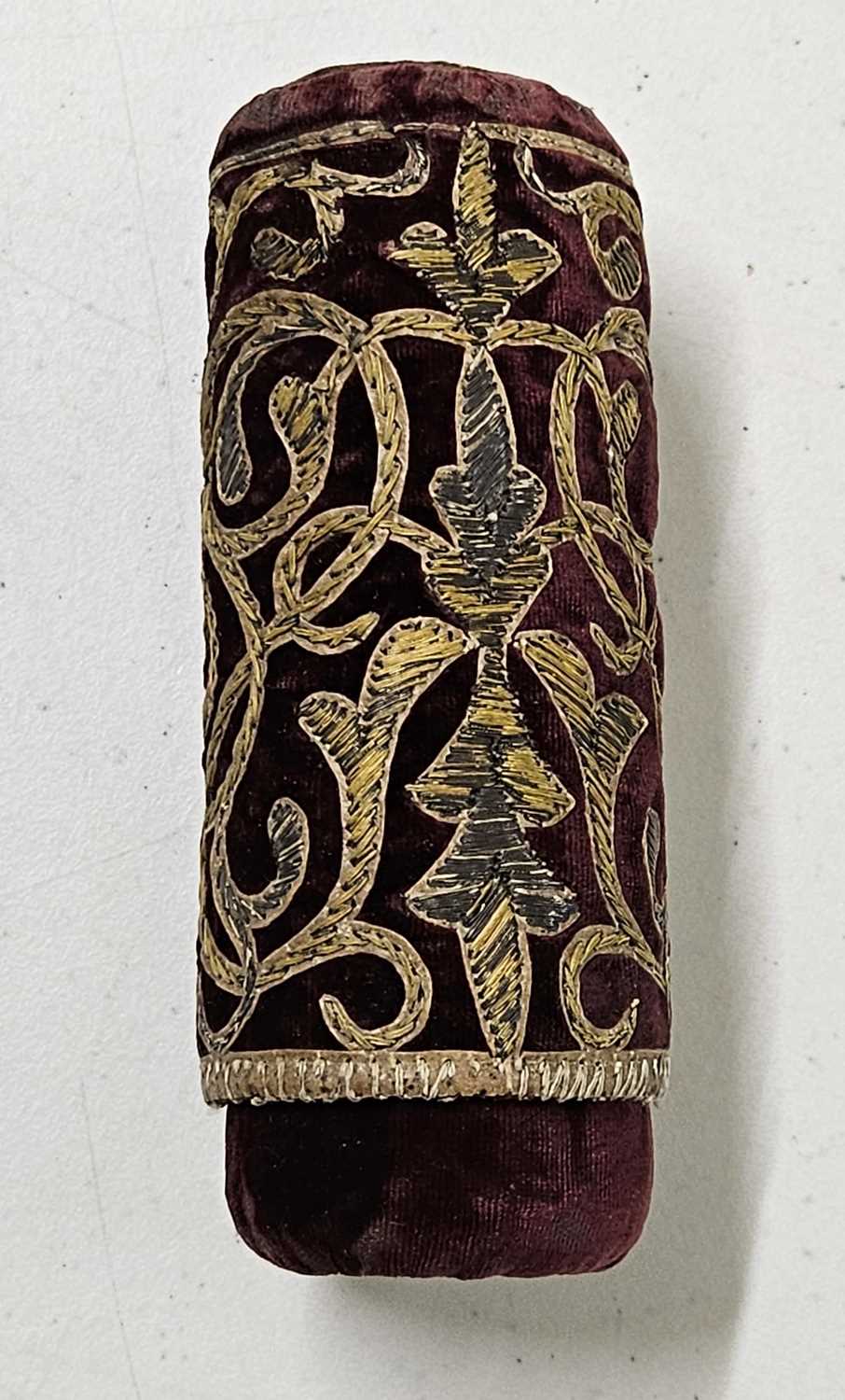 Lot 415 - Embroidered scroll case. A metalwork scroll