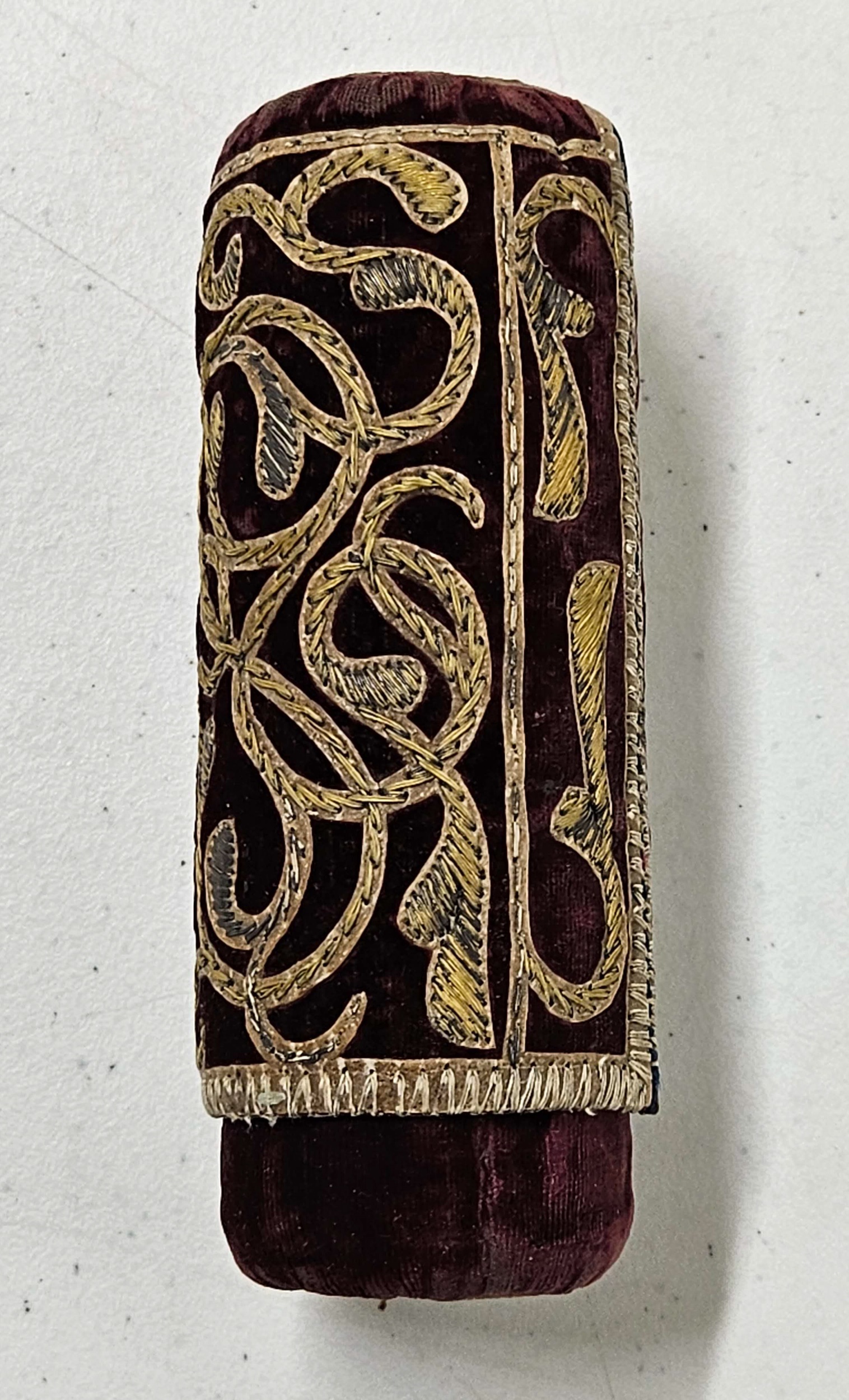 Lot 415 - Embroidered scroll case. A metalwork scroll