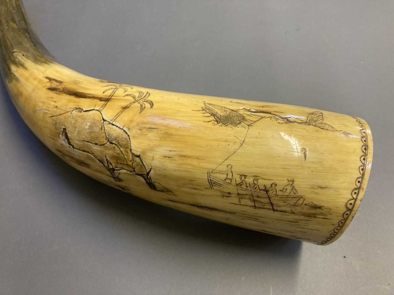 Lot 379 - Scrimshaw. A scrimshaw work cow horn, carved