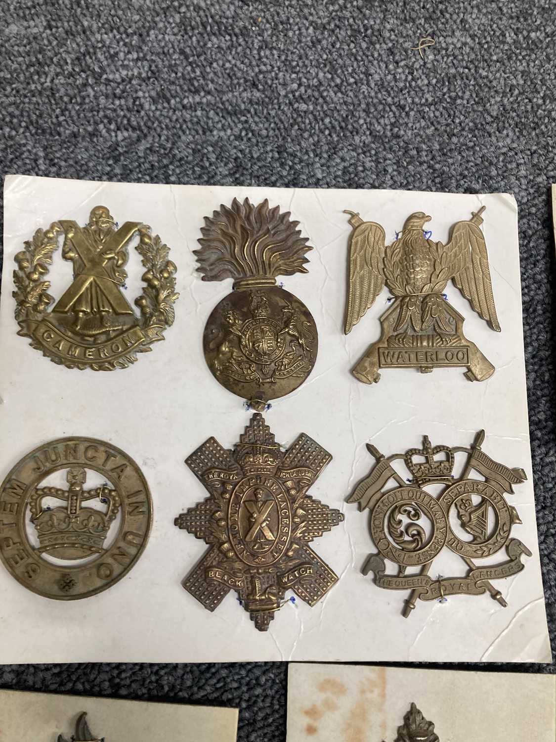 Lot 60 - Cap Badges. A collection of military cap