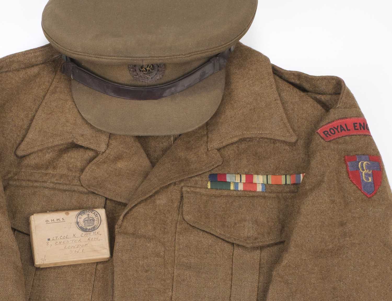 Lot 271 - Uniforms. A WWII military trunk and contents