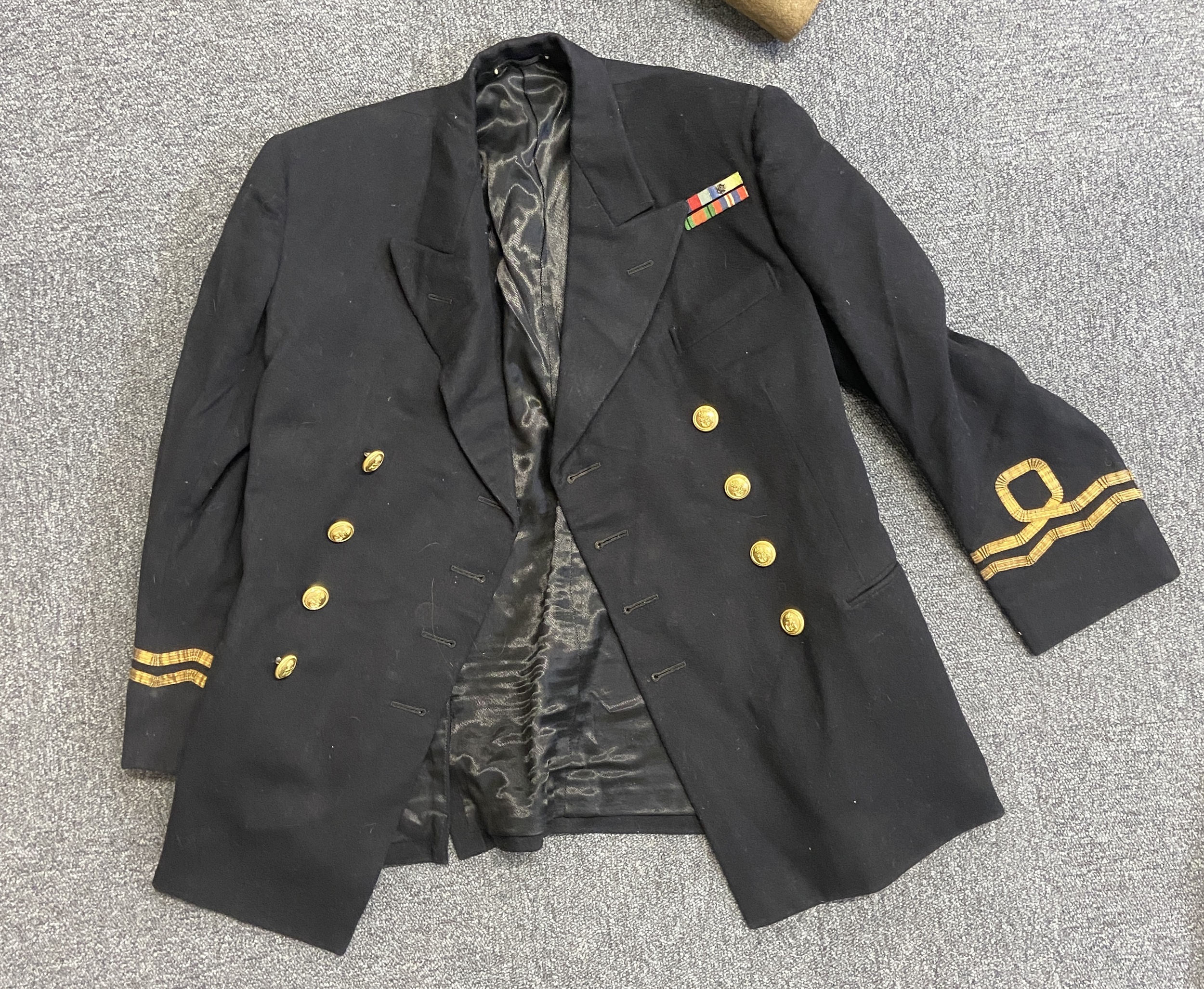 Lot 296 - Military Uniforms. A WWII officers' uniform