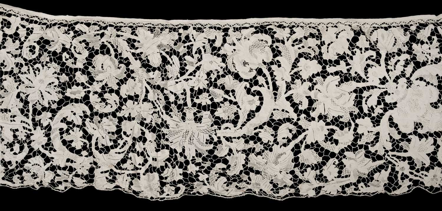 Lot 541 - Lace. A flounce of intricate needlelace,