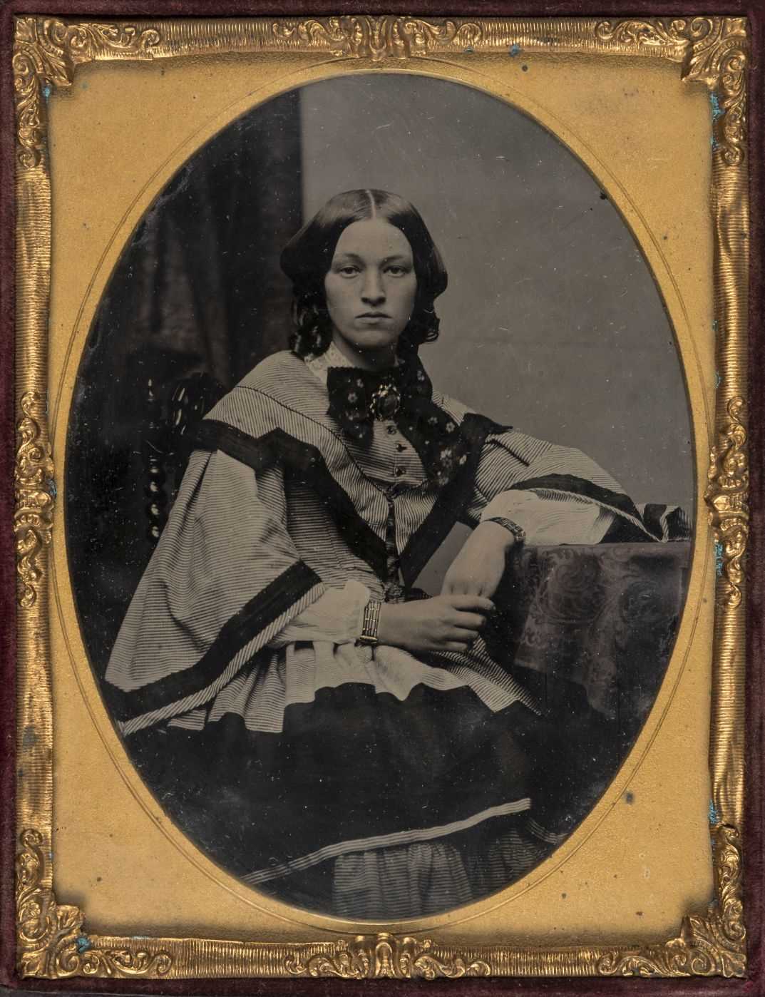 Lot 334 - Sixth-plate tinted ambrotype of a woman,